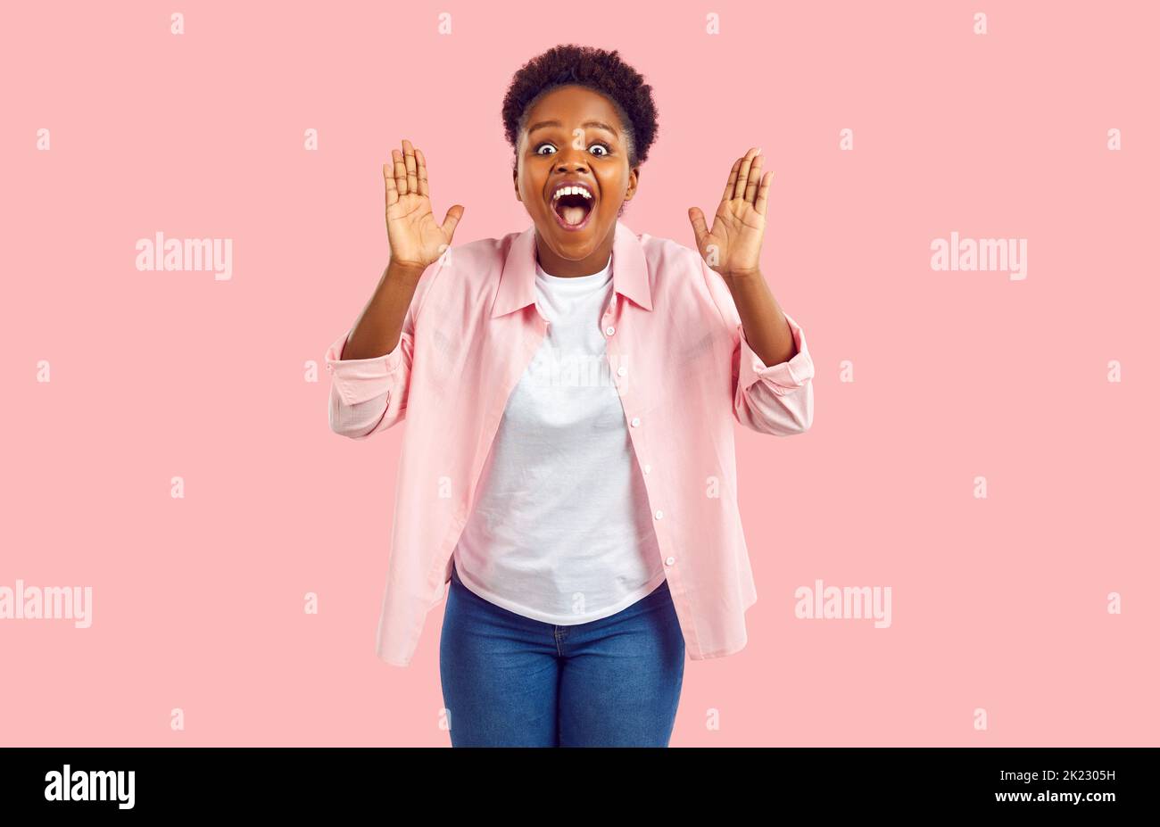 Overjoyed African American woman screams WoW seeing unexpected surprise ...