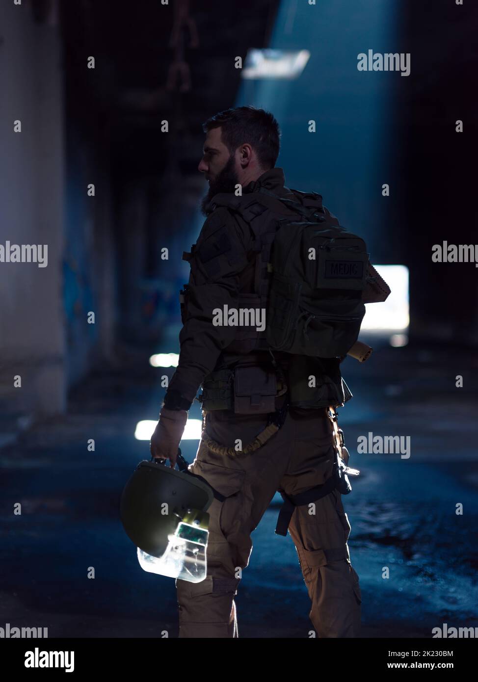 Army soldier in Combat Uniforms with an assault rifle and combat helmet ...