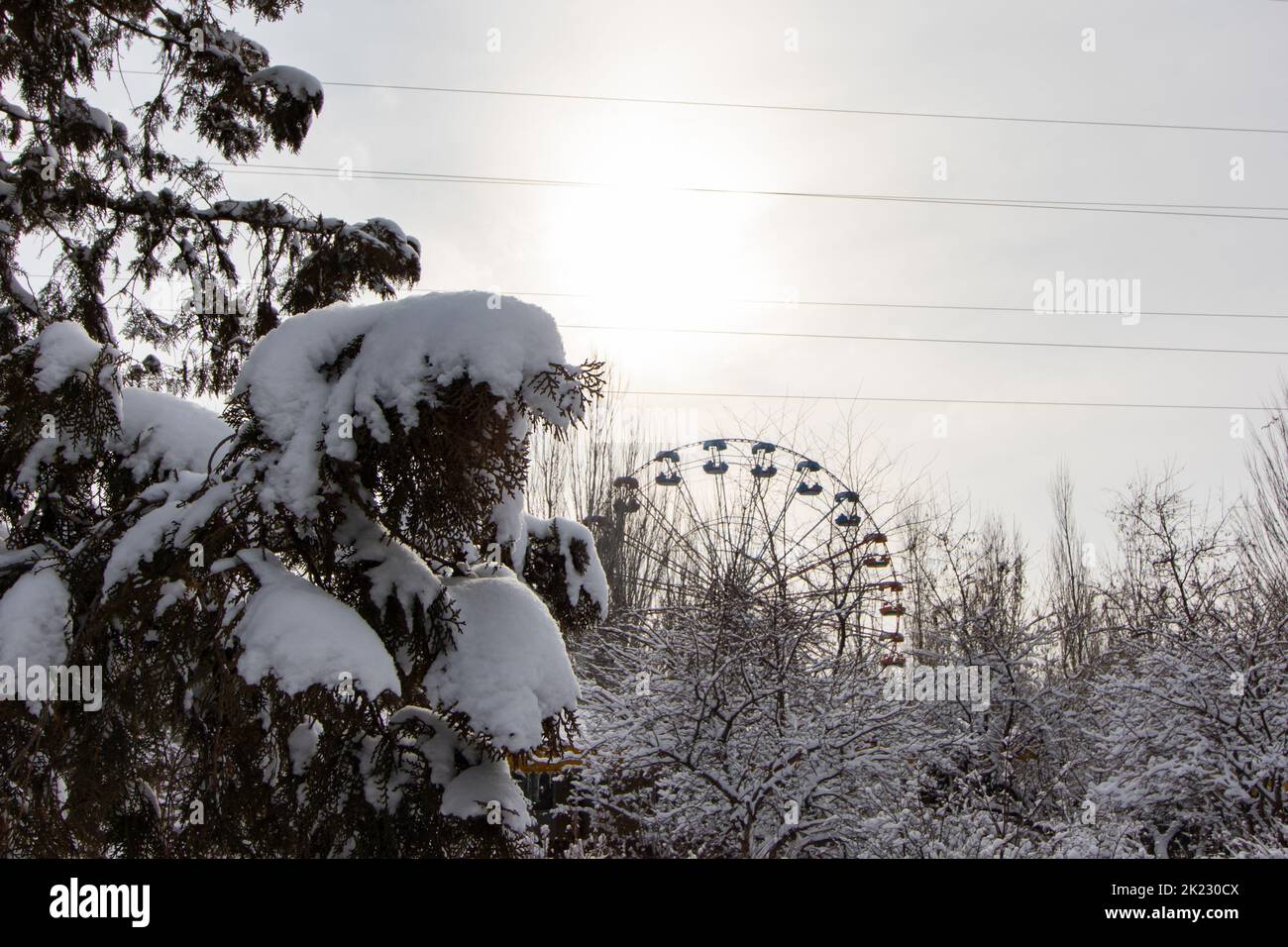 The Bishkek ferris wheel in a park covered with snow Stock Photo - Alamy