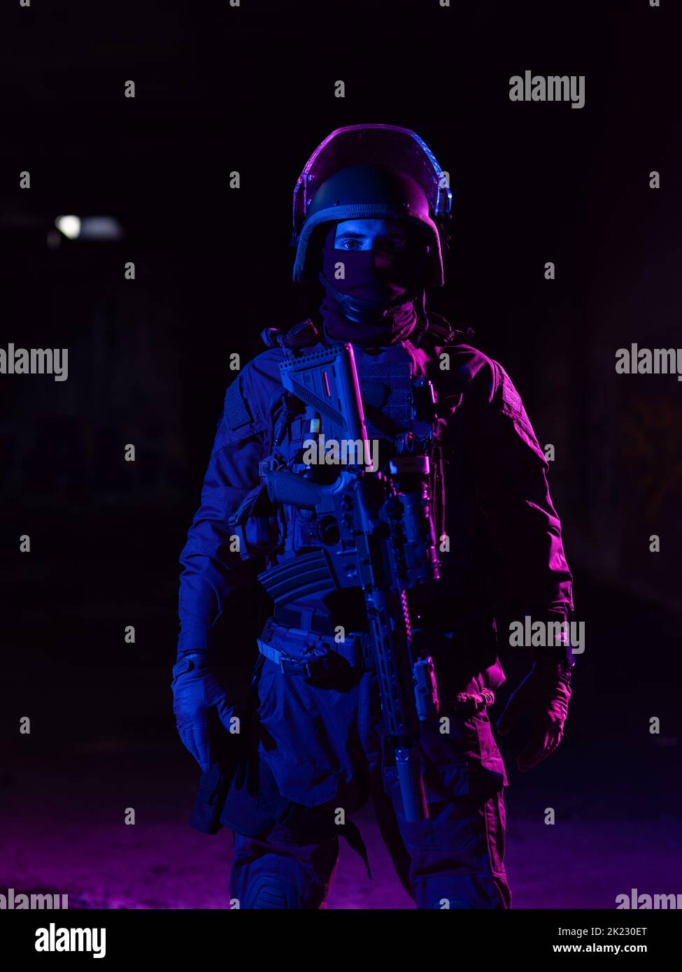 Army soldier in Combat Uniforms with an assault rifle and combat helmet ...