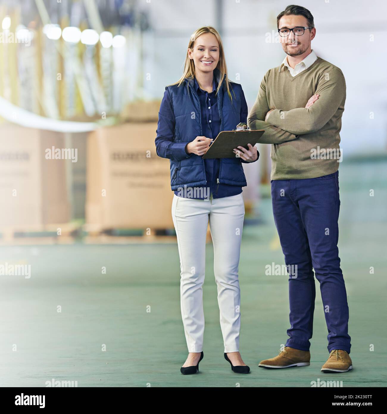 Running a factory with finesse. Portrait of a two smiling managers ...