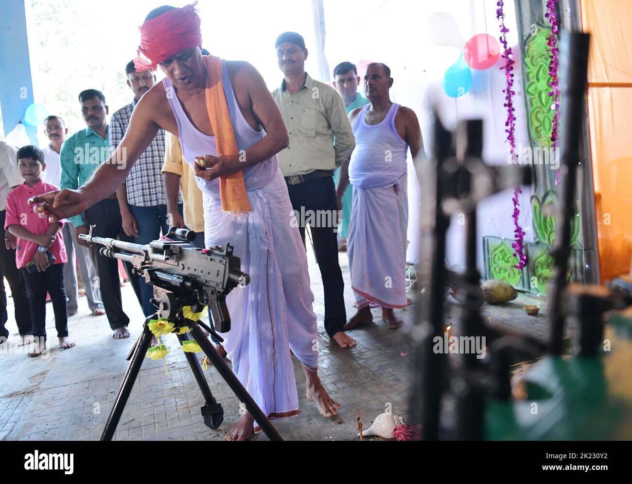 A priest blessing weapons belonging to TSR 2nd Battalion (Tripura State ...