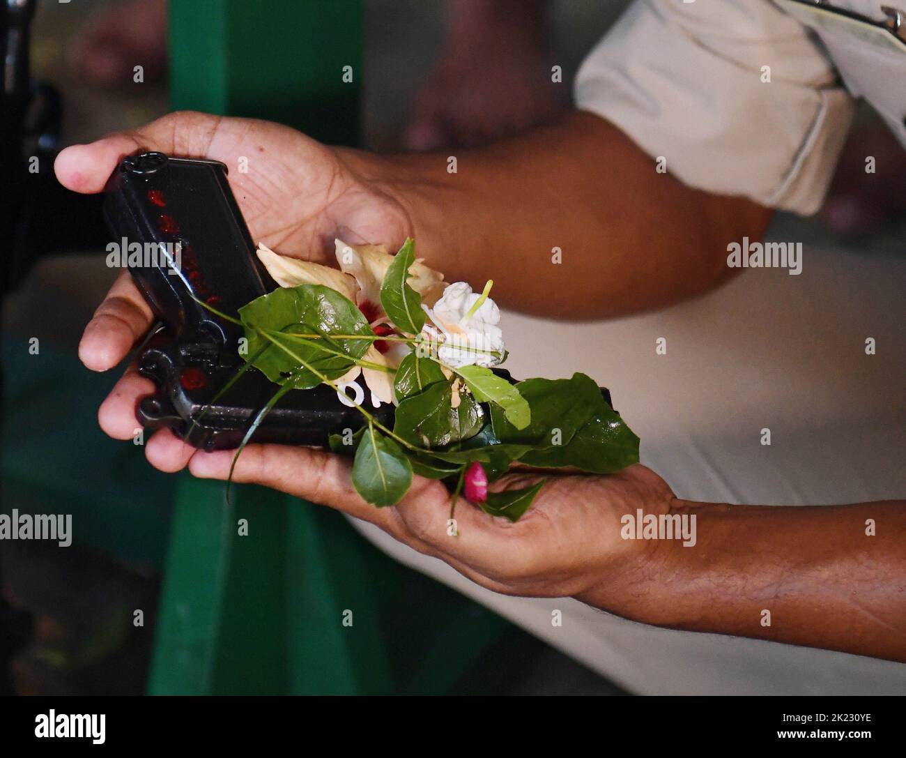 A priest blessing weapons belonging to TSR 2nd Battalion (Tripura State ...