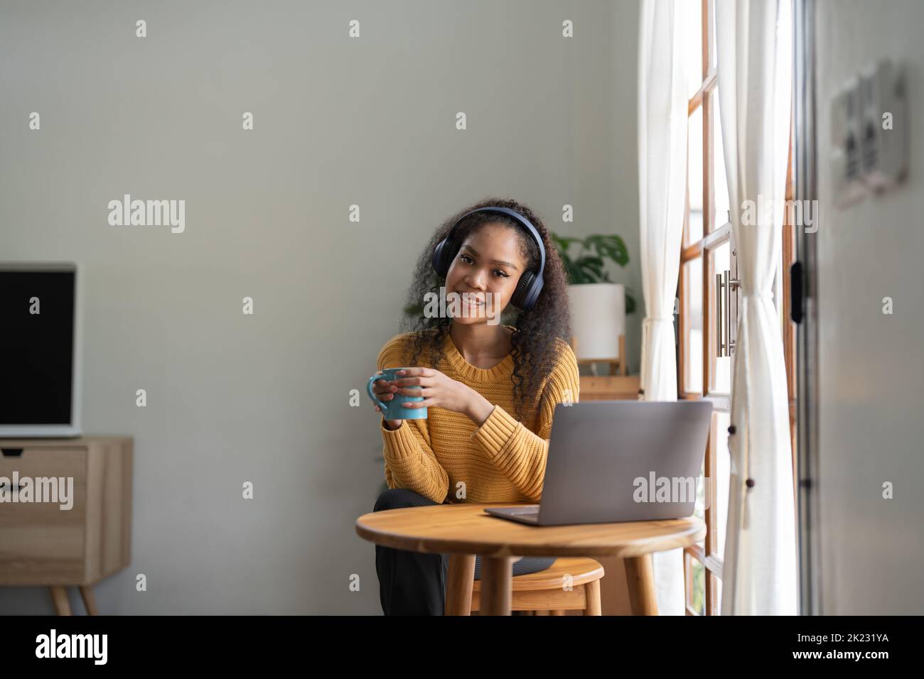 Portrait of African American woman talking on video conference call ...