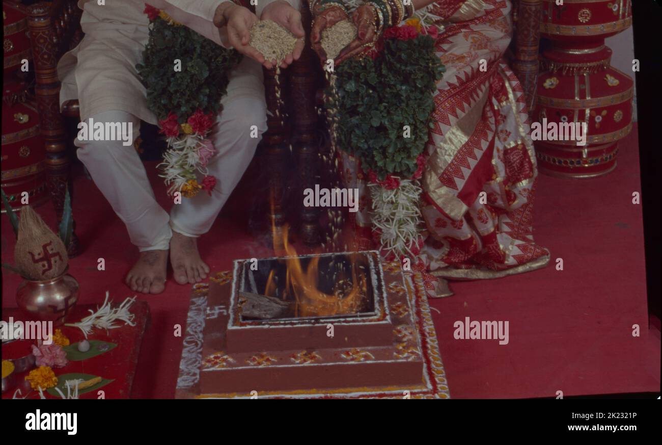 Hindu Wedding, Bride & Groom Making Offerings To The Ceremonial Fire ...