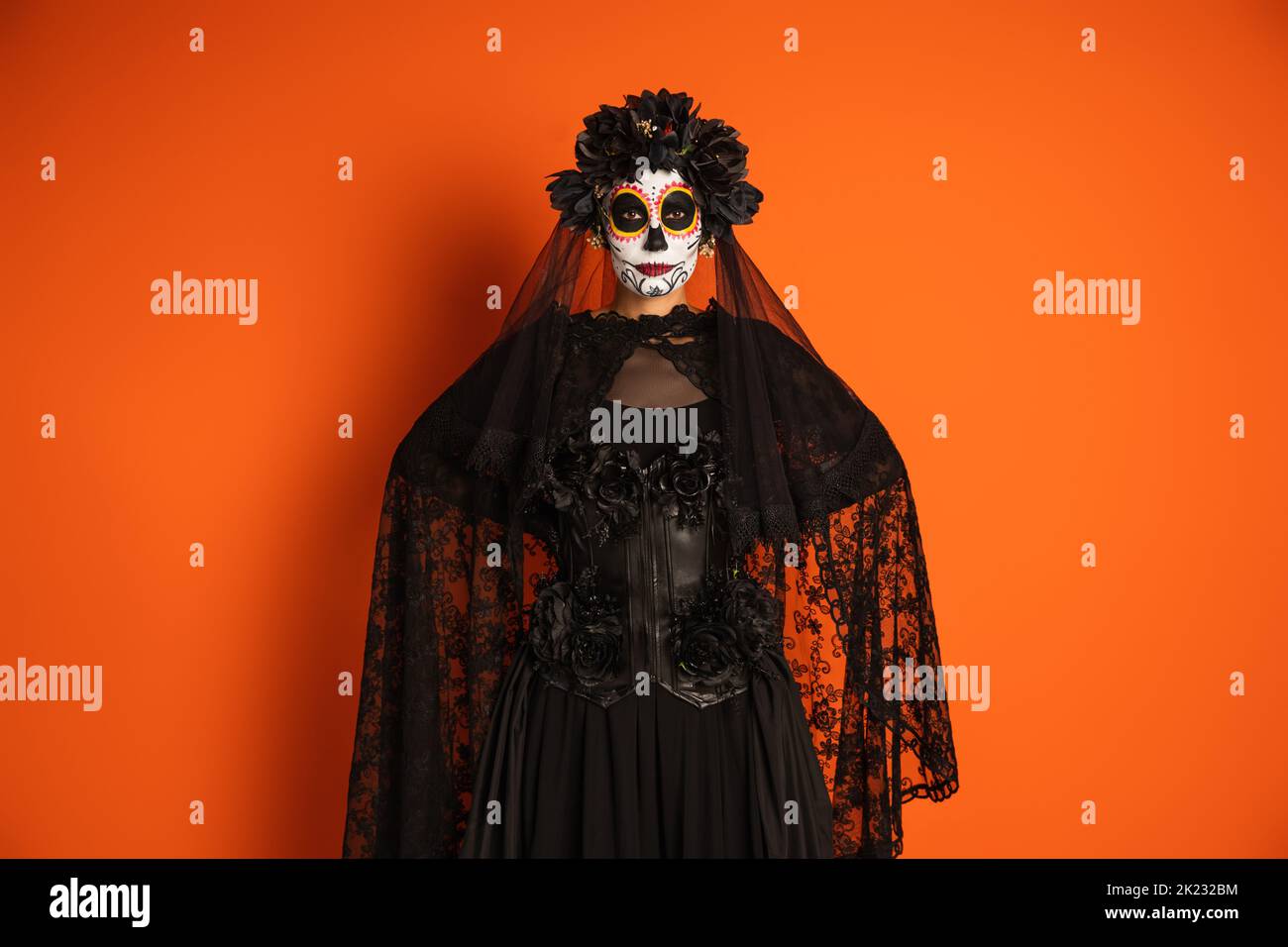 woman in traditional santa muerte makeup and costume with black lace ...