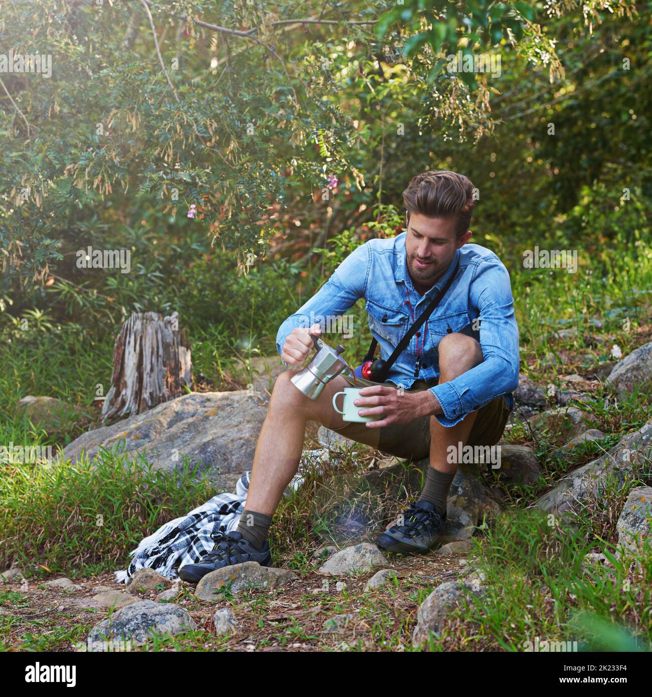 Insert coffee to begin. a young man drinking a coffee while out on a ...