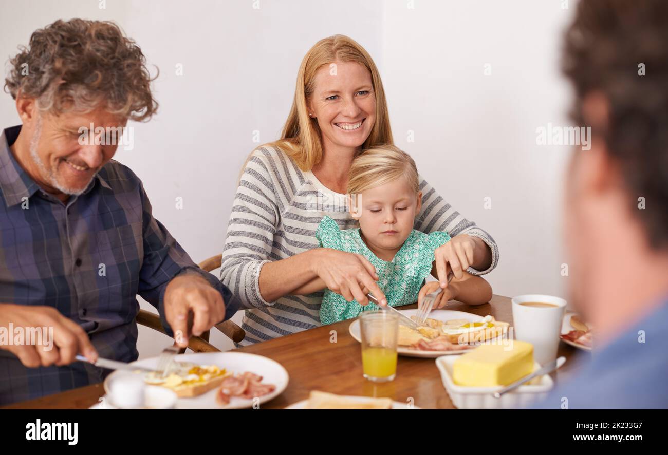 Bonding over breakfast. A cropped shot of a multi-generation family ...