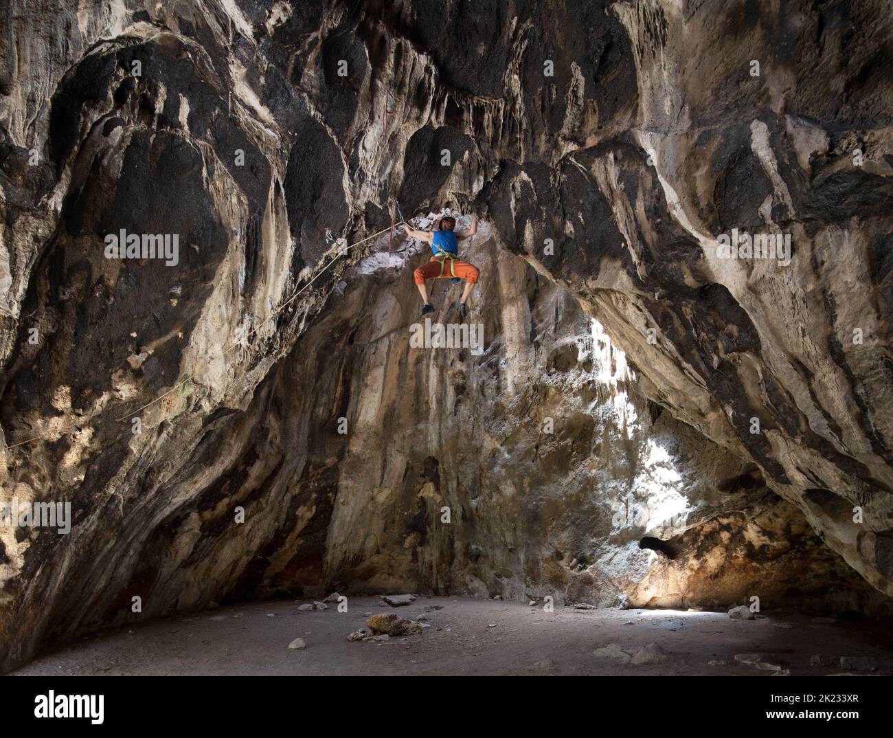 Climber in a cave Stock Photo - Alamy