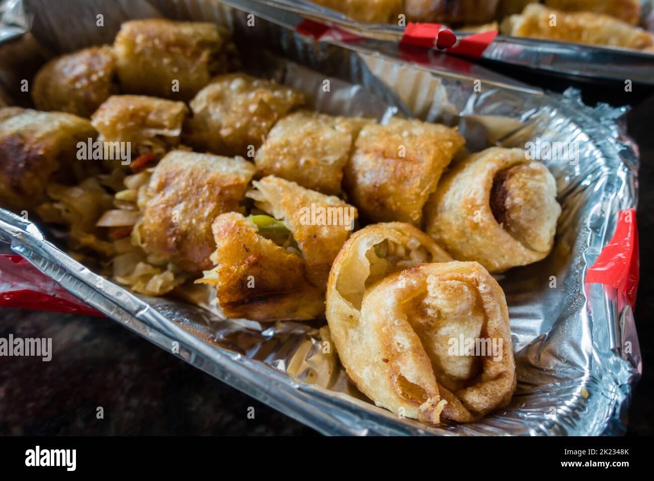 Fried Spring rolls or dim sum in an aluminum ordered online. Dehradun ...