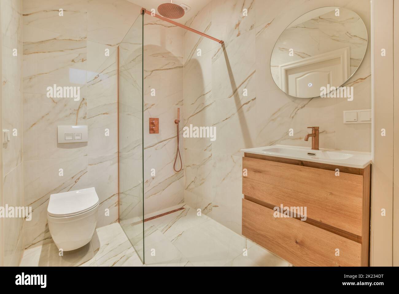 Glass partition between shower tap and wall hung toilet in modern ...