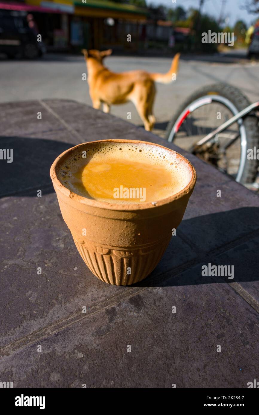 Hot Indian spiced tea served in a traditional clay pot glass called ...