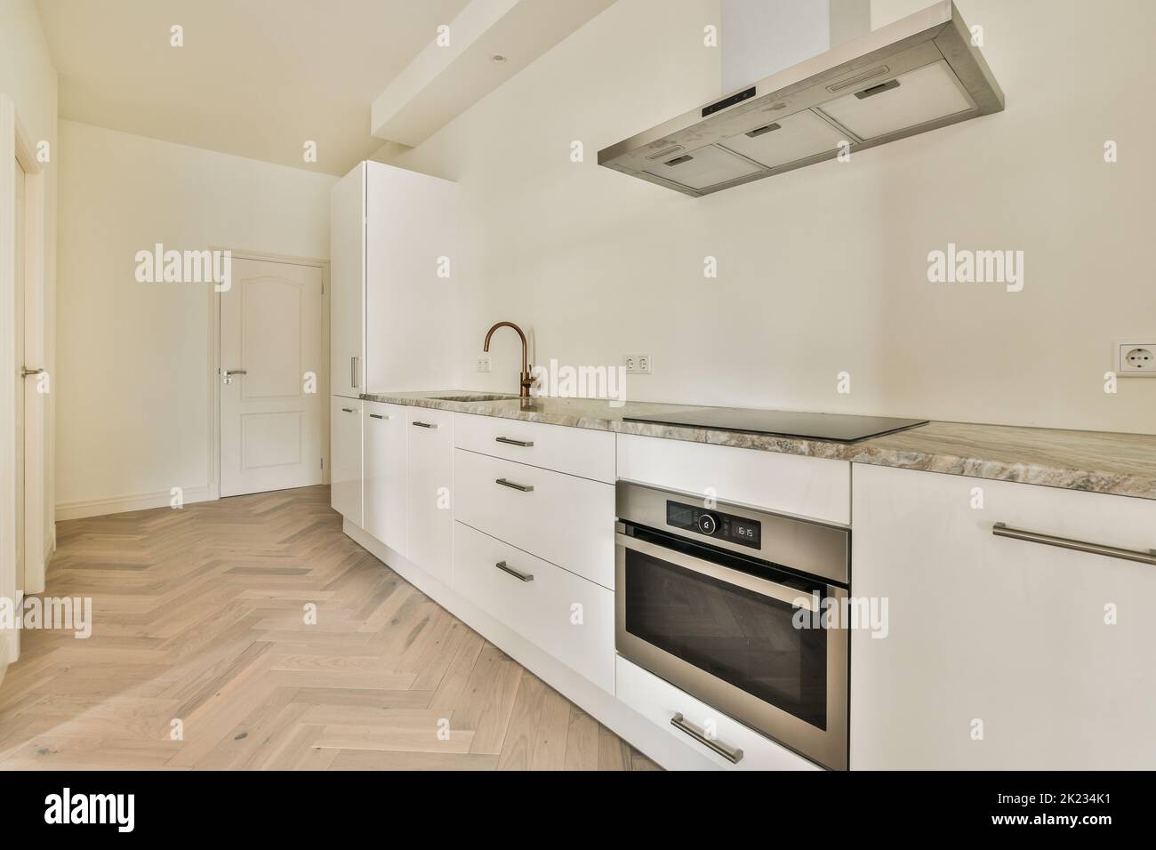 Interior of empty kitchen with corridor and wooden parquet floor Stock ...
