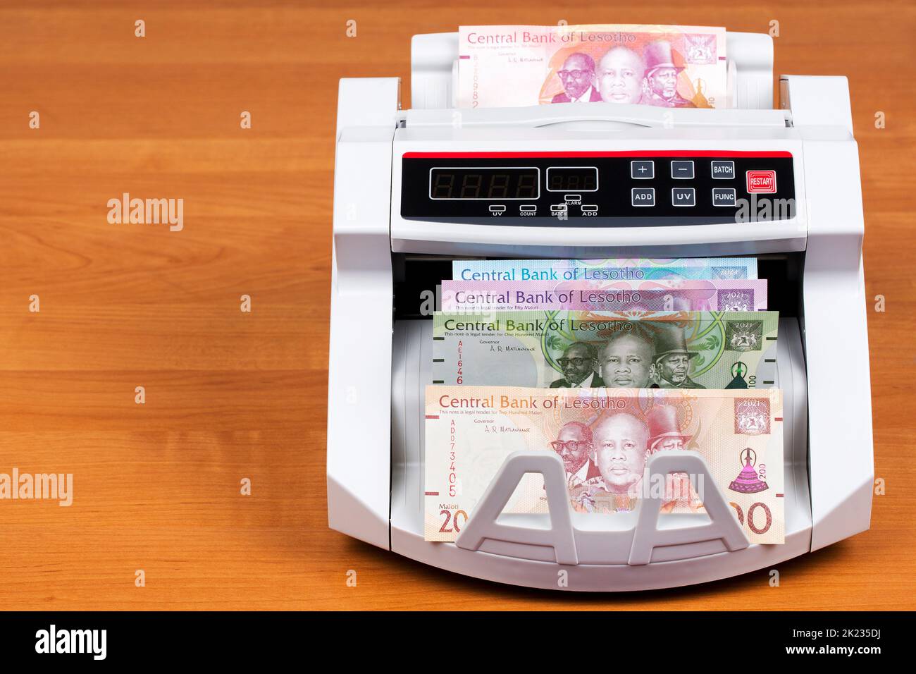 Banknotes of Lesotho - Maloti in the counting machine Stock Photo - Alamy