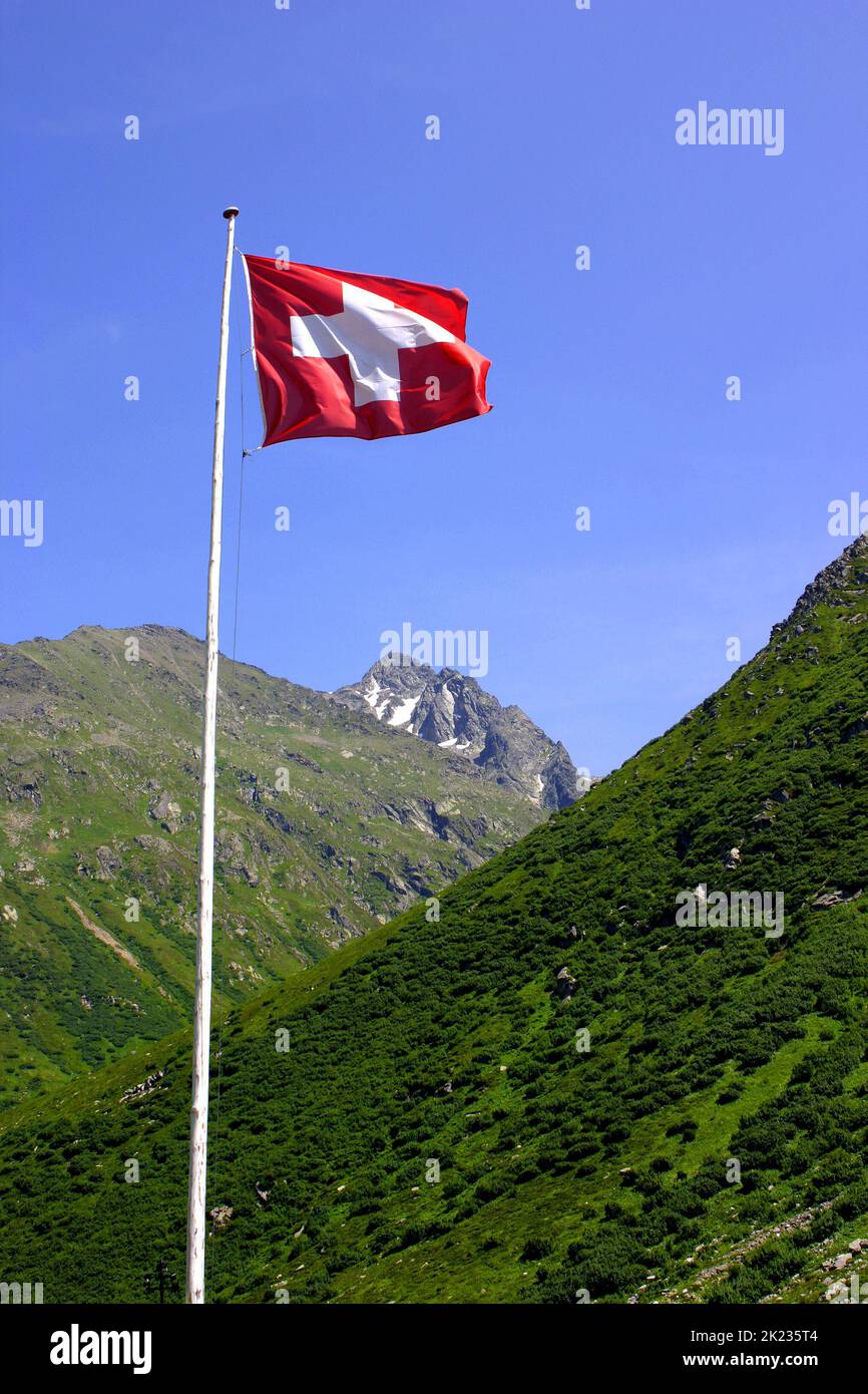 Alpine and Swiss Flag flying in the Swiss Alps, Switzerland Stock Photo ...