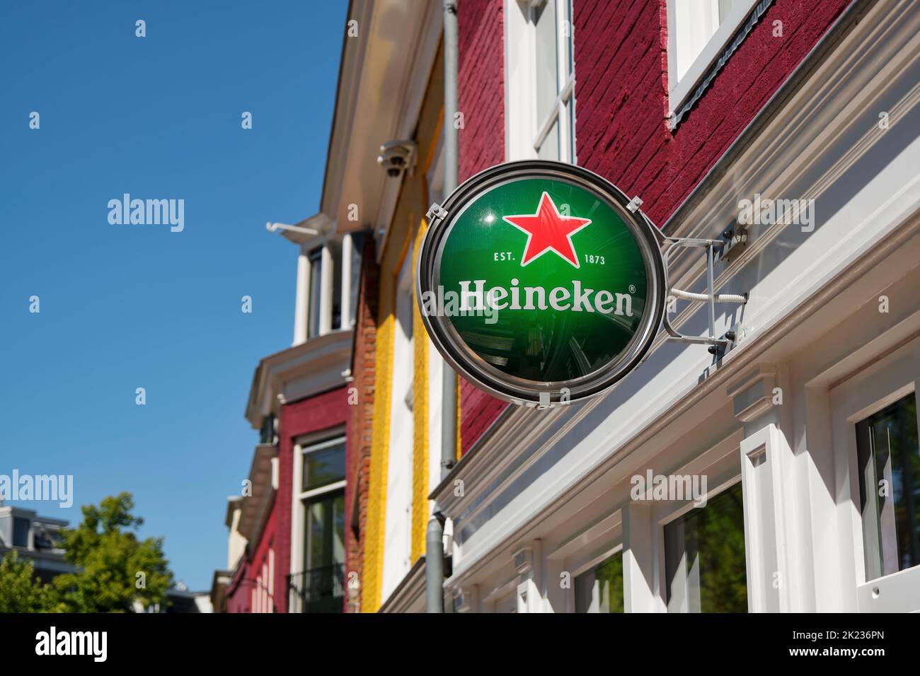 Heineken sign on a pub in summer during daytime. Heineken is a dutch ...