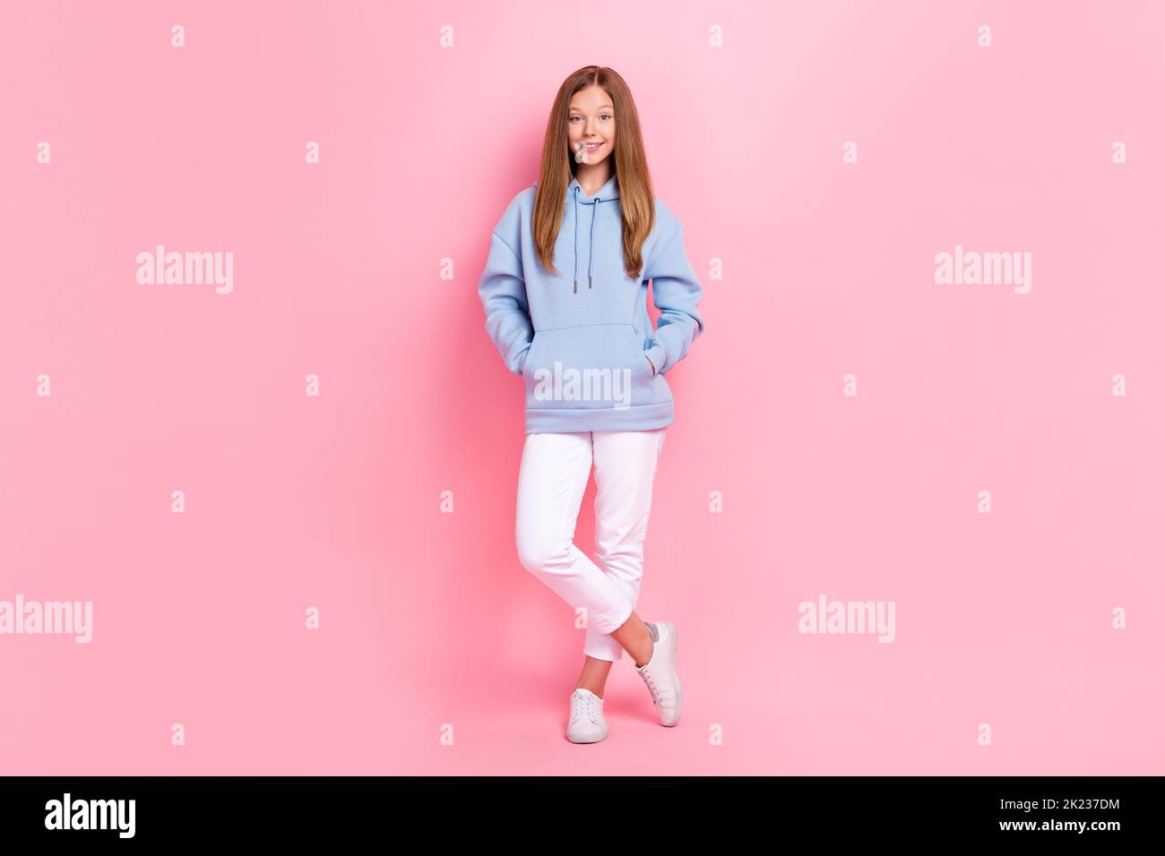 Full size photo of satisfied cute girl put arms pockets have good mood ...