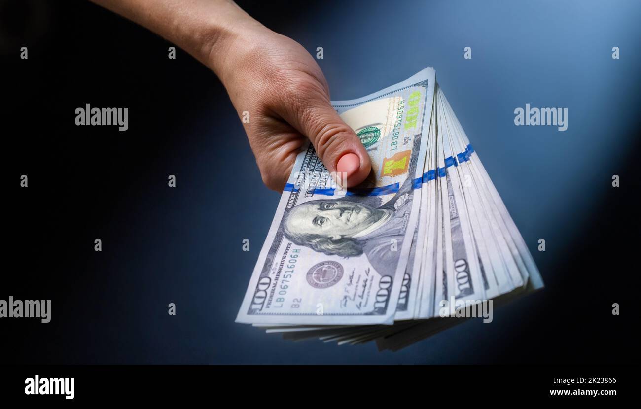 Hand holding banknotes Stock Photo - Alamy