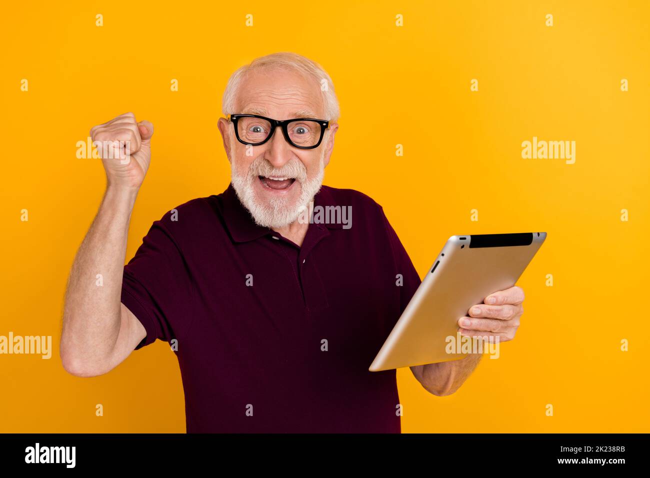 Photo of mature man rejoice victory lucky use tablet hooray triumph ...