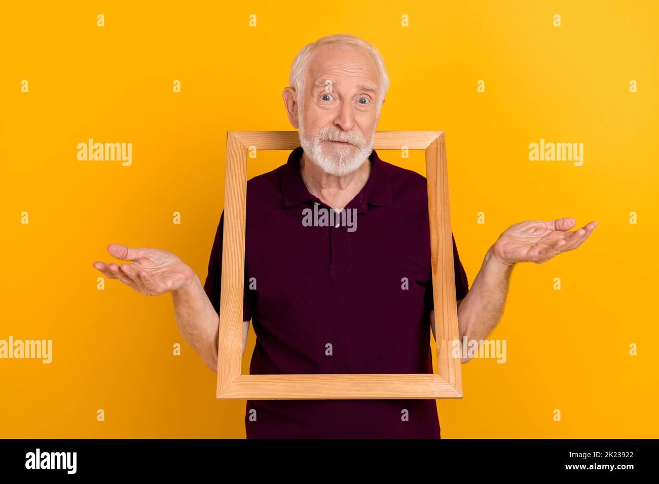 Photo of mature man puzzled make picture album shrug shoulders isolated ...