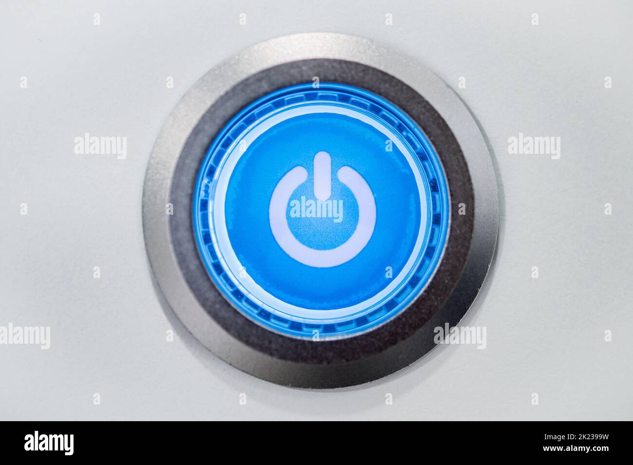 Blue tuned power button glowing Stock Photo - Alamy