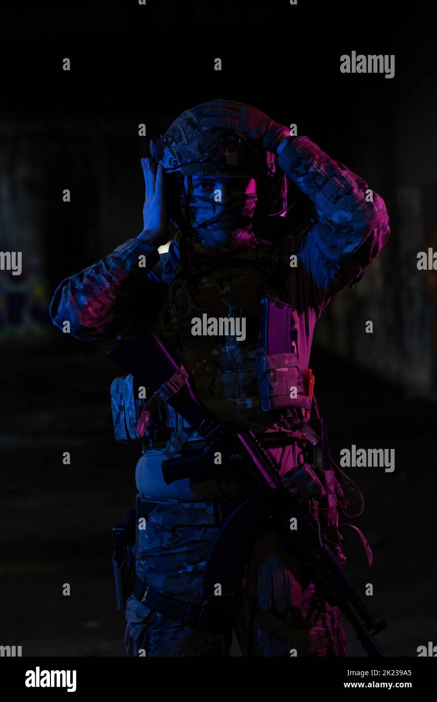 Army soldier in Combat Uniforms with an assault rifle and combat helmet ...