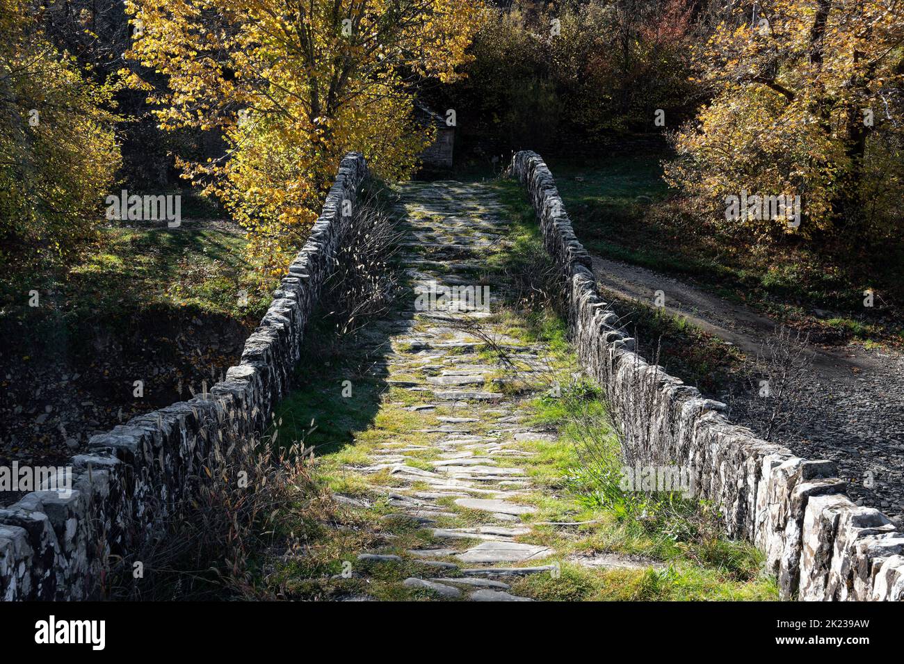 View of the traditional stone Mylos Bridge in Epirus, Greece in Autumn ...