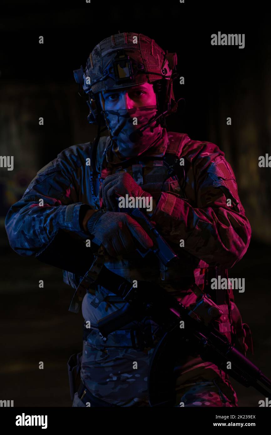 Army soldier in Combat Uniforms with an assault rifle and combat helmet ...