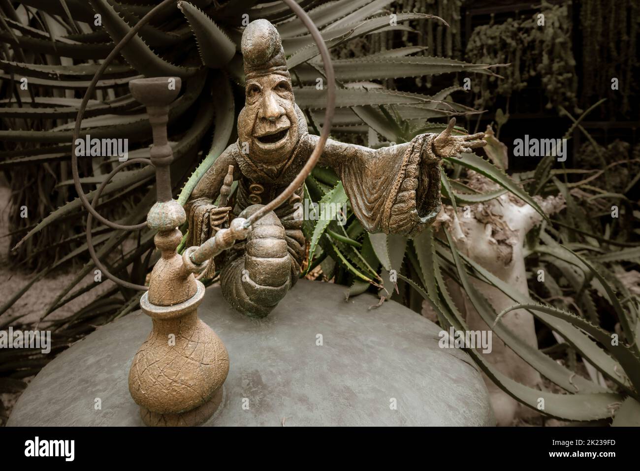 Singapore, July 24, 2022 - statue of the catepillar smoking a hookah ...