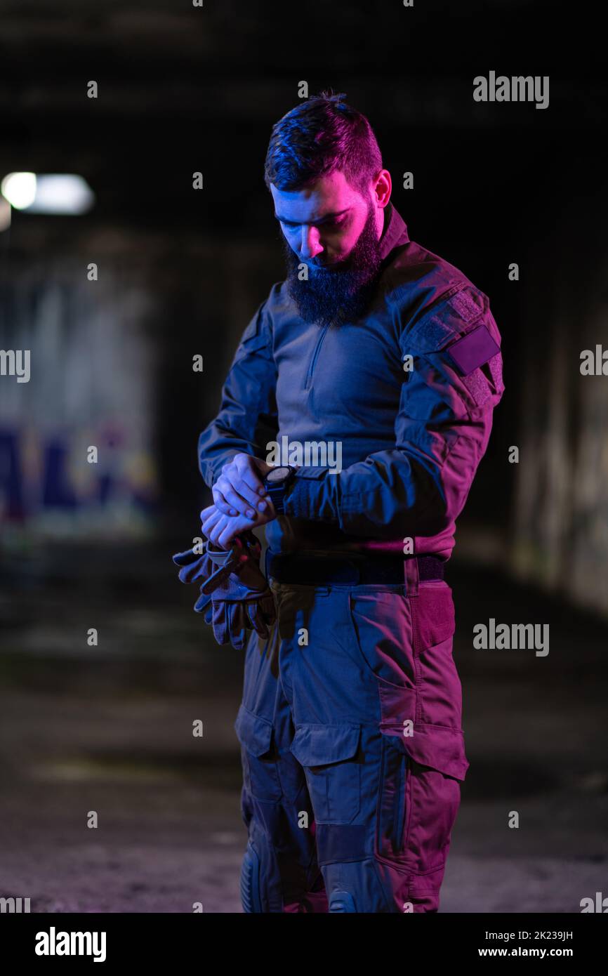 Modern warfare soldier checking navigation, time and other information ...