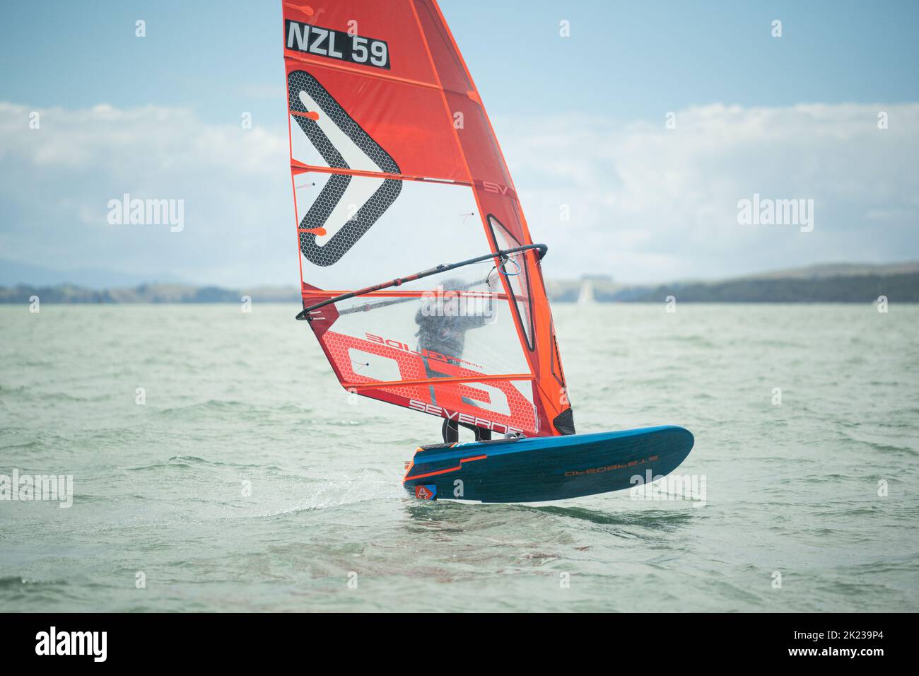 A man competes in a national windsurfing hydrofoil race at the ...