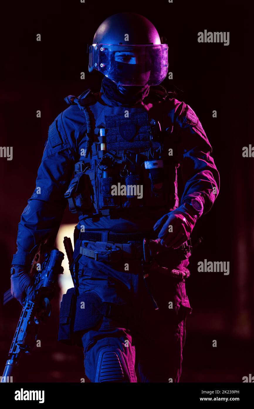 Army soldier in Combat Uniforms with an assault rifle and combat helmet ...