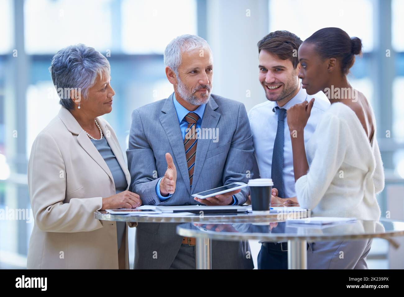 Having a successful business meeting. a group of businesspeople having ...