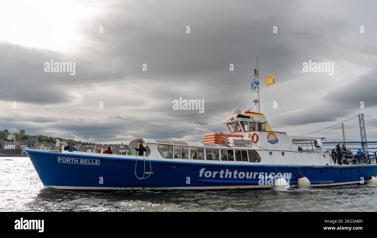 The Forth Belle tourist boat in the Firth of Forth with the Forth Road ...