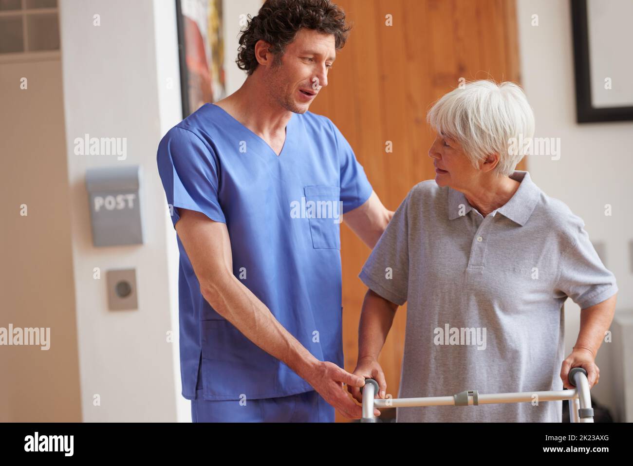 There to provide encouragement along the way. a male doctor assisting ...