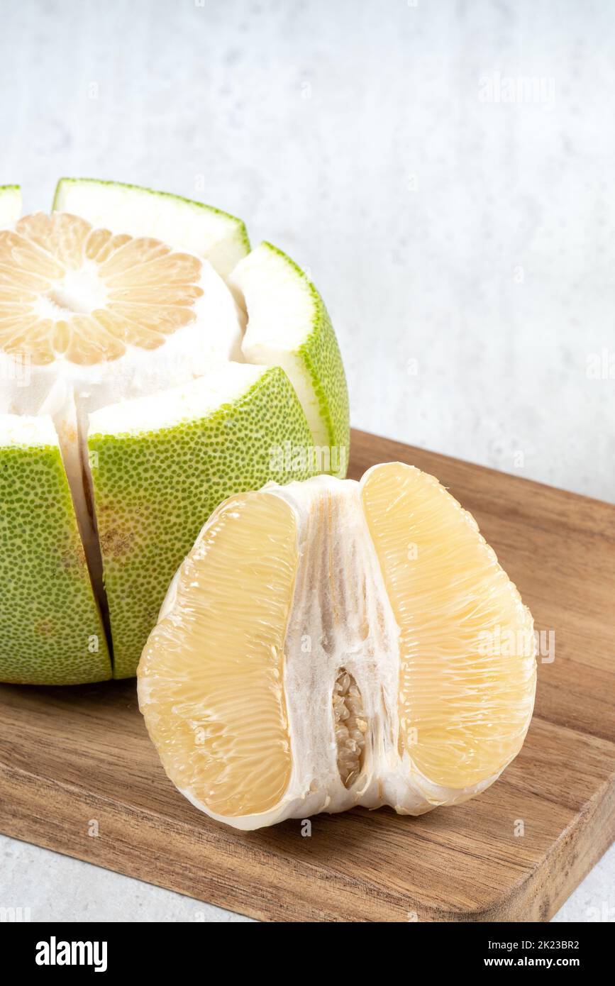 Close up of fresh peeled pomelo on white table background for Mid ...