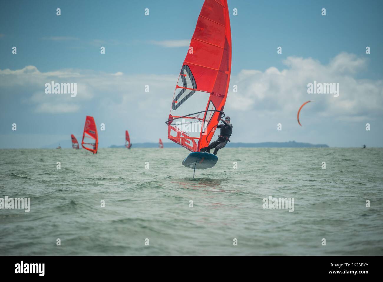 Competitors race in a national windsurfing hydrofoil race at the ...