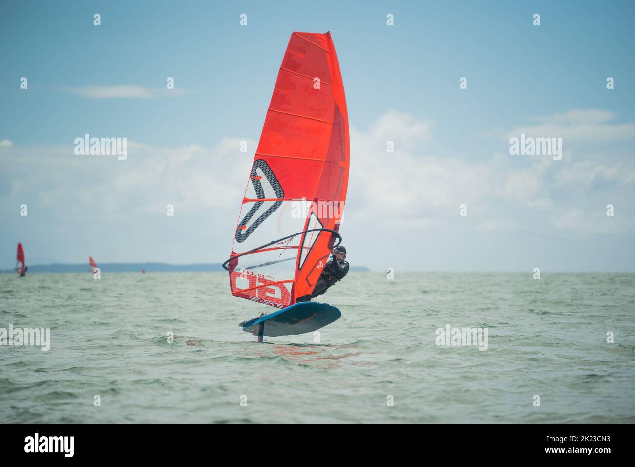 A man competes in a national windsurfing hydrofoil race at the ...