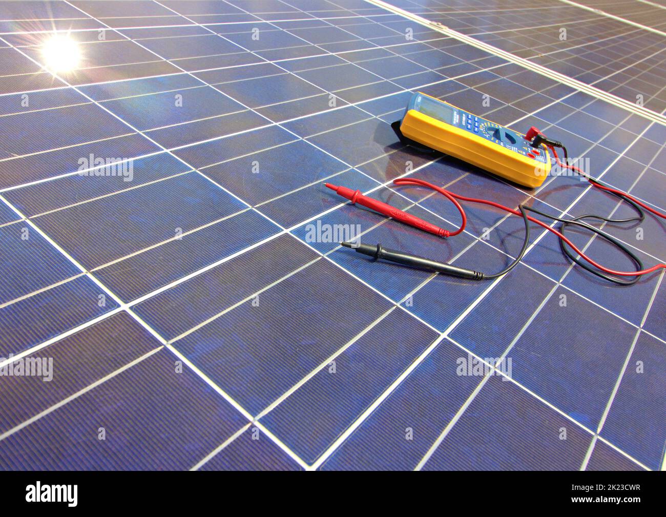 Meter on solar panels with sunshine Stock Photo - Alamy