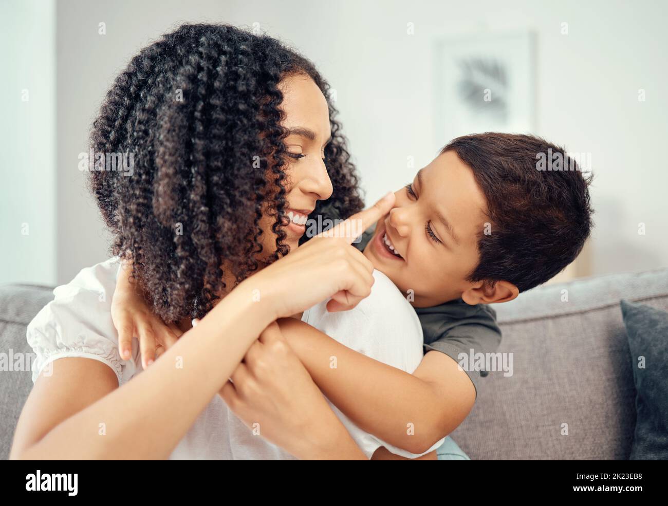 Family, woman and child bonding in house living room, home sofa and ...