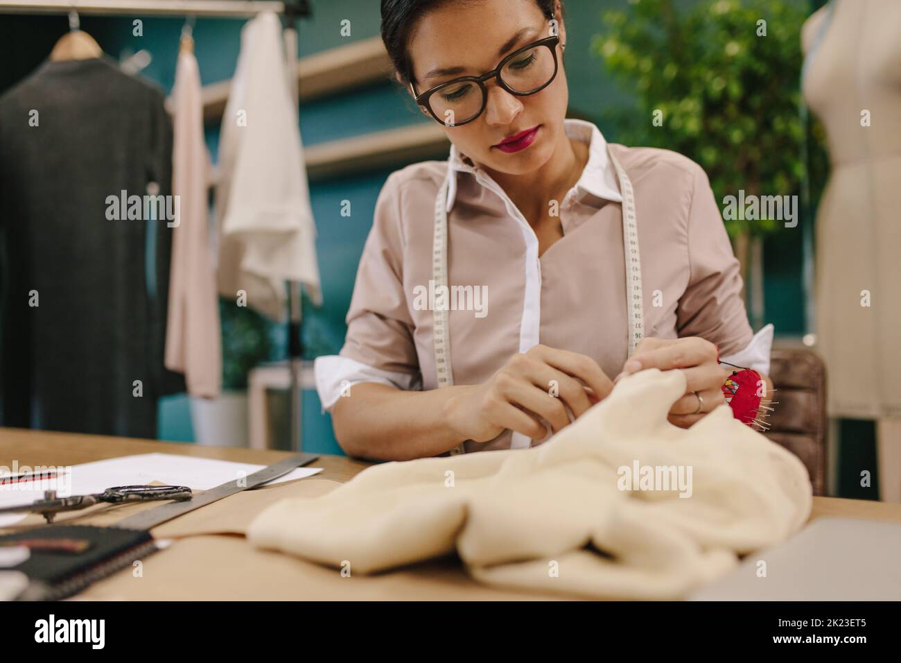 Asian seamstress making garment in hi-res stock photography and images ...