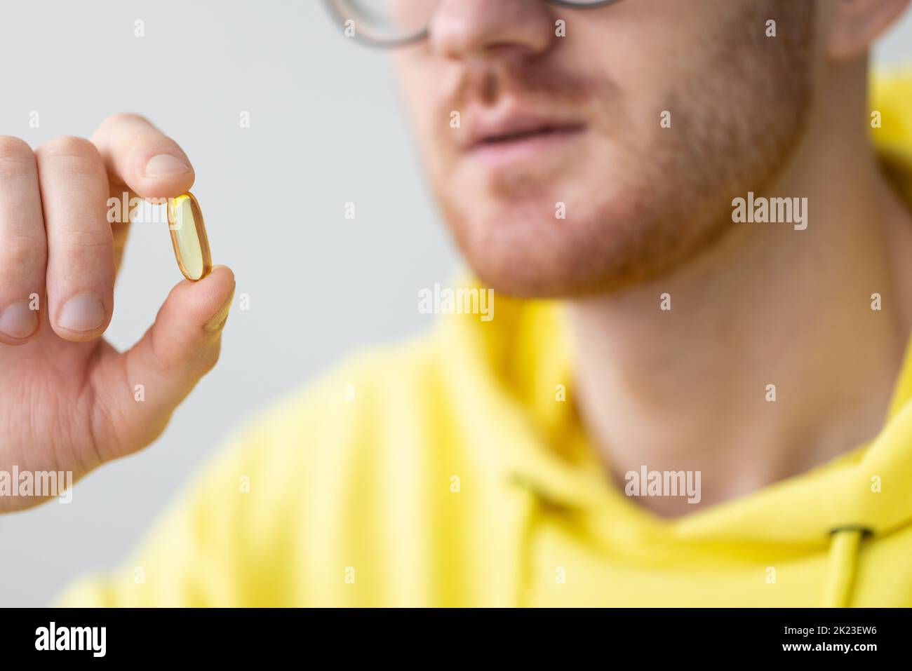 Smiling man takes vitamins. Closeup. Healthcare and medicine Stock ...