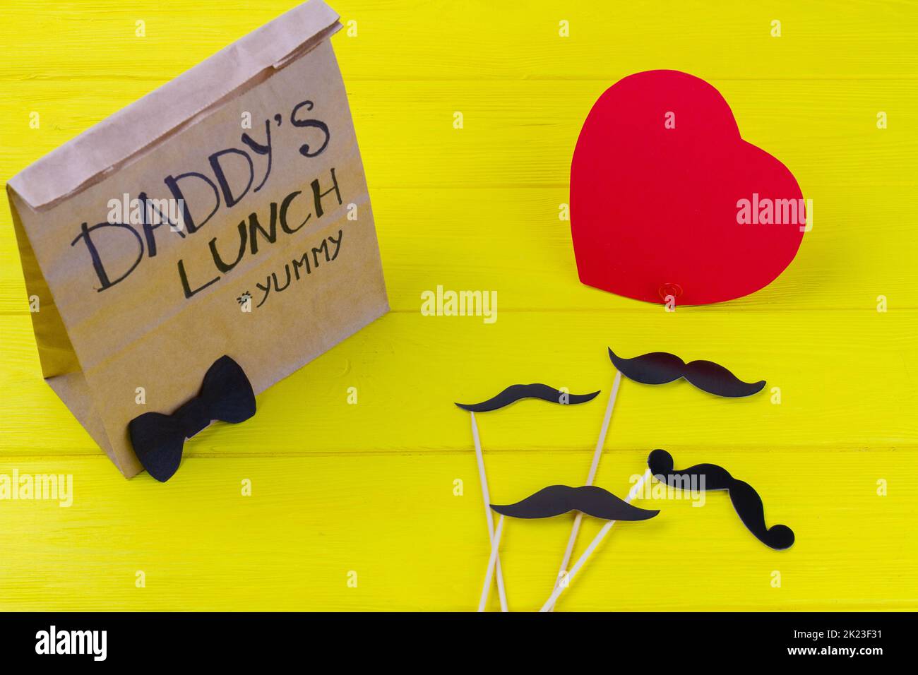 Paper bag with daddy lunch and heart. Fathers day concept. Moustaches ...