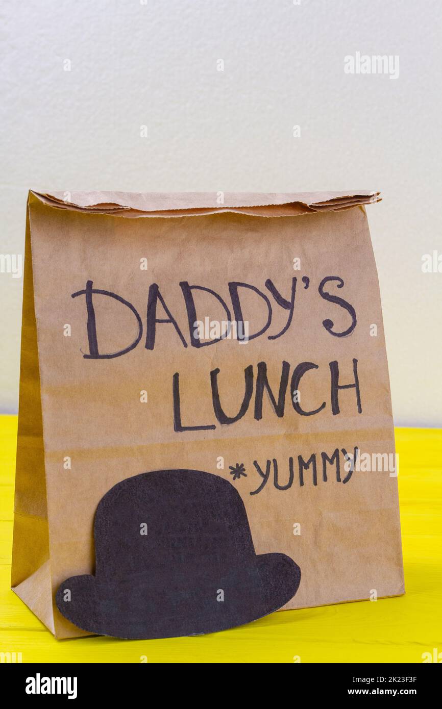 Paper bag with yummy daddys lunch with hat. Fathers day concept Stock ...