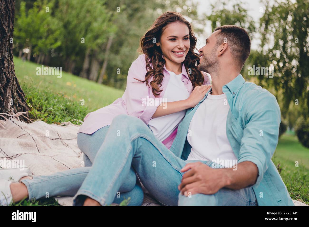 Photo of dreamy adorable two people together wear casual shirts smiling ...