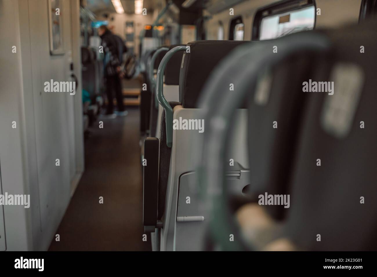 View of interior in a deserted empty commuter train carriage with rows ...