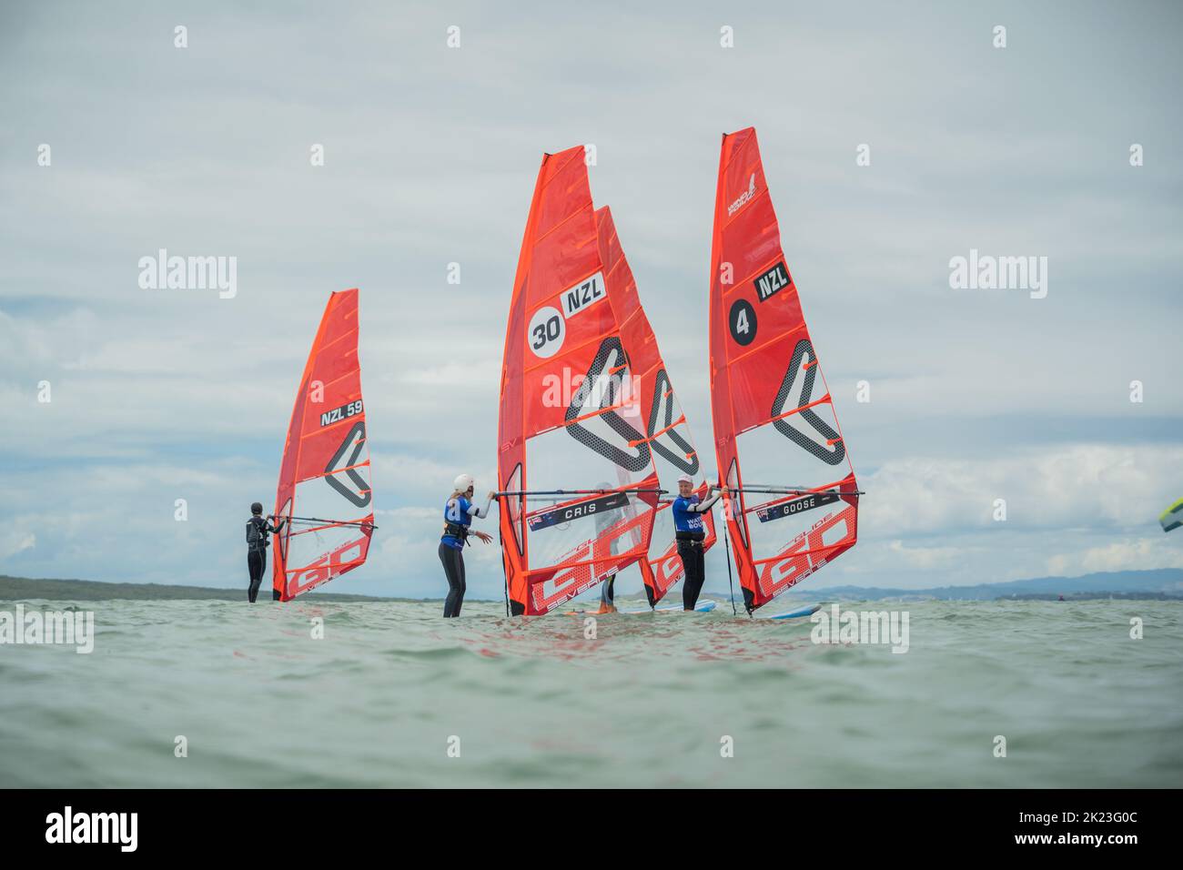 Competitors race in a national windsurfing hydrofoil race at the ...