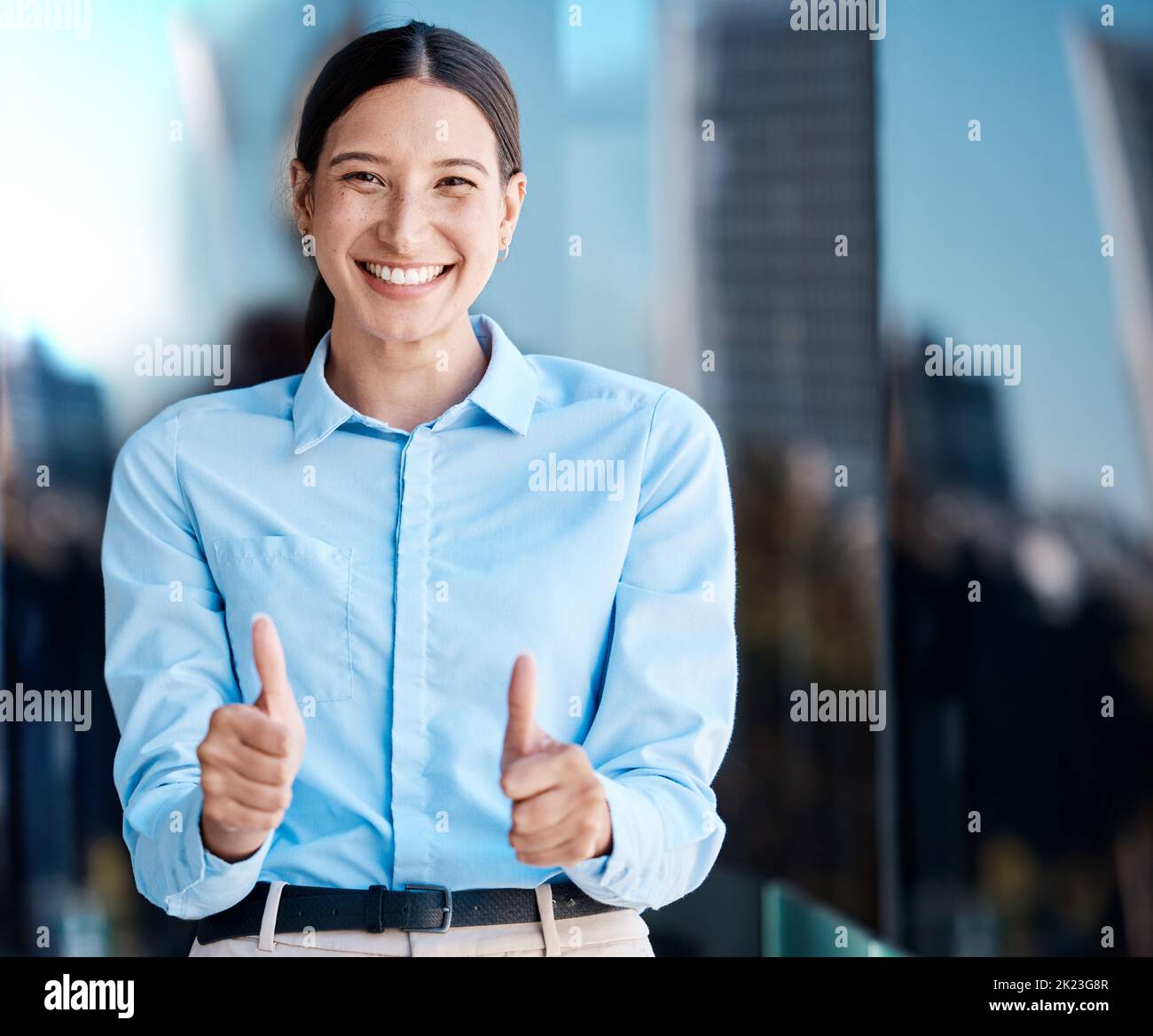 Thumbs up, hands and success with a business woman saying thank you ...
