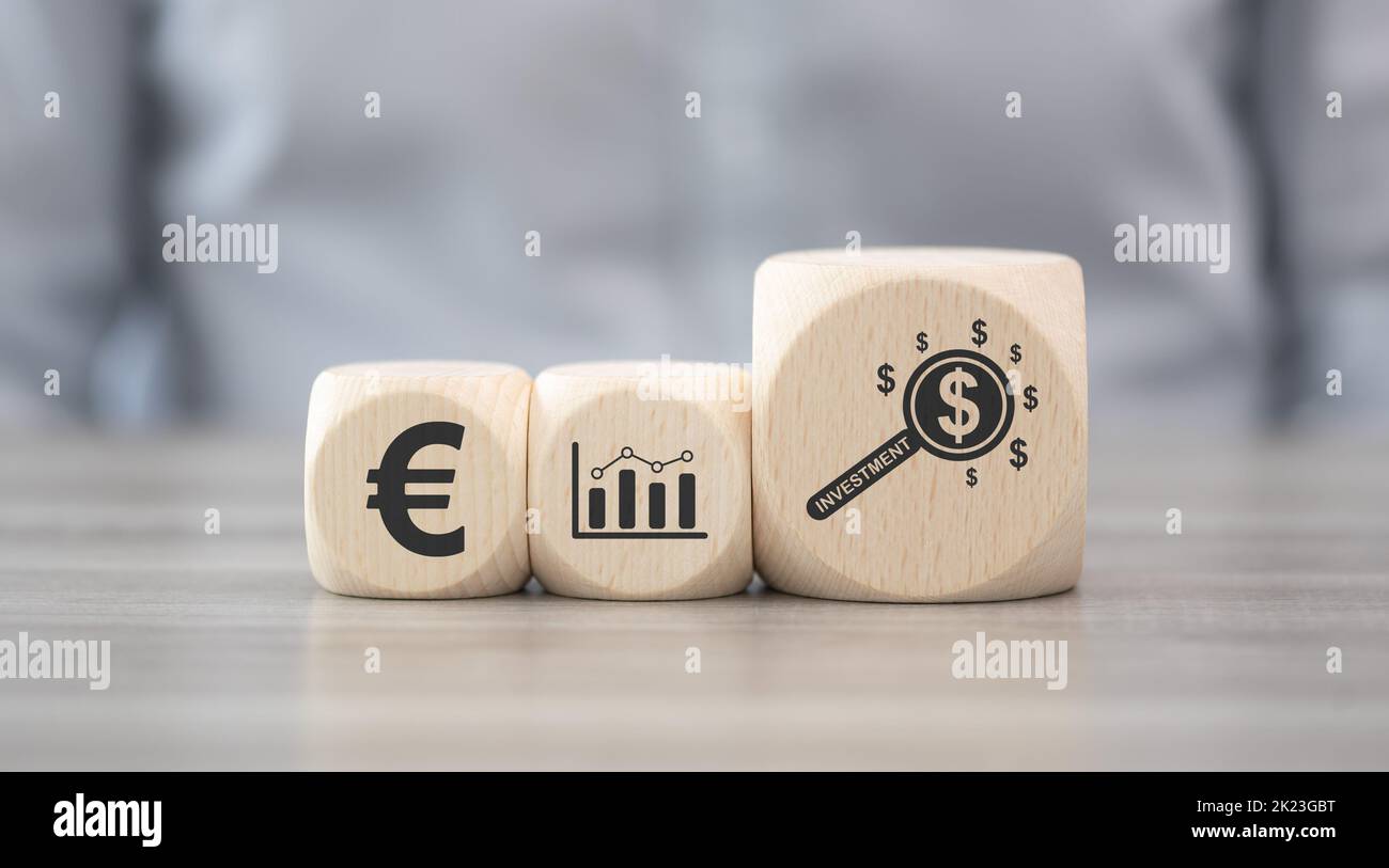 Wooden blocks with symbol of investment concept Stock Photo - Alamy
