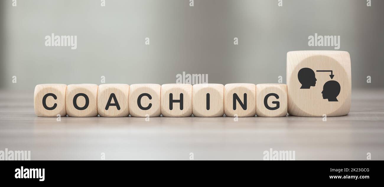 Wooden blocks with symbol of coaching concept Stock Photo - Alamy